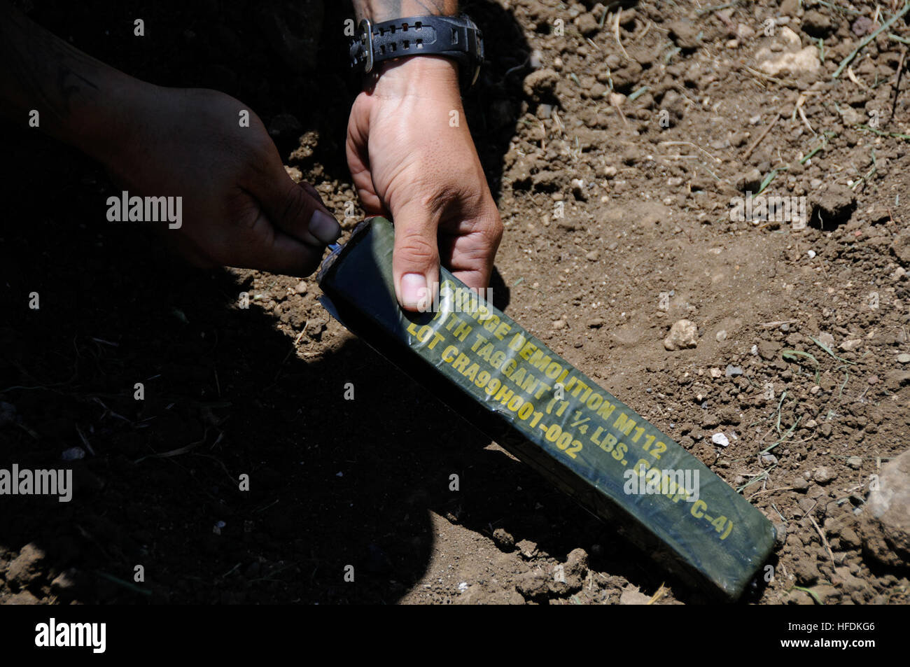 A Marine from 4th Force Reconnaissance Company inserts a blasting cap ...