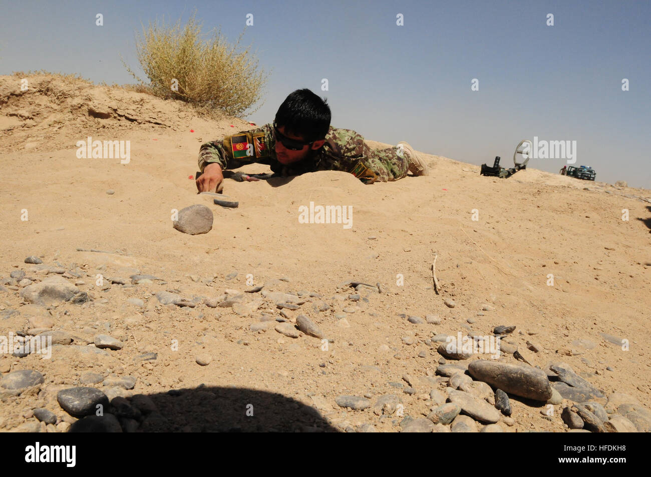 A student at the explosive hazard reduction course uncovers a practice ...