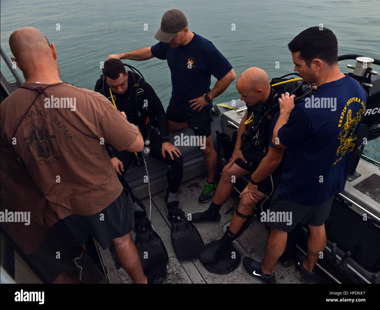 U.S. Navy sailors assigned to Mobile Diving and Salvage Unit 2, prepare ...