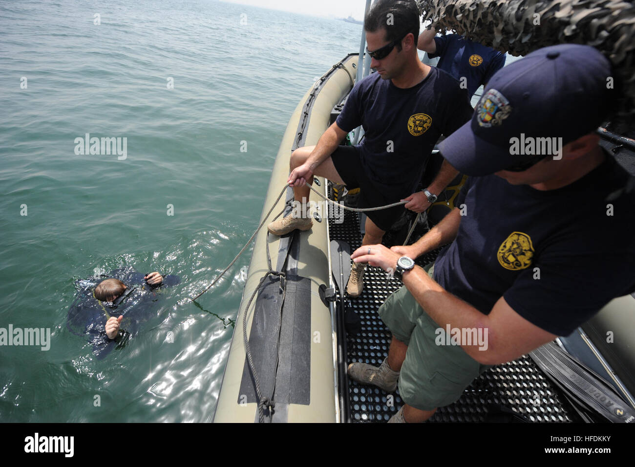 Navy Petty Officer 2nd Class Justin Cavitt, left, a diver; Navy Petty ...