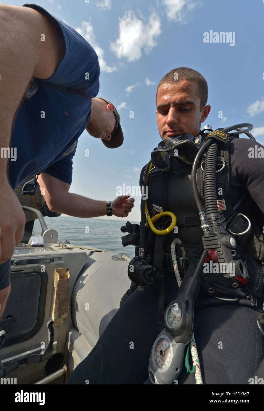 Navy Diver 1st Class Ben Cohn, left, and Navy Diver 3rd Class Patrick ...
