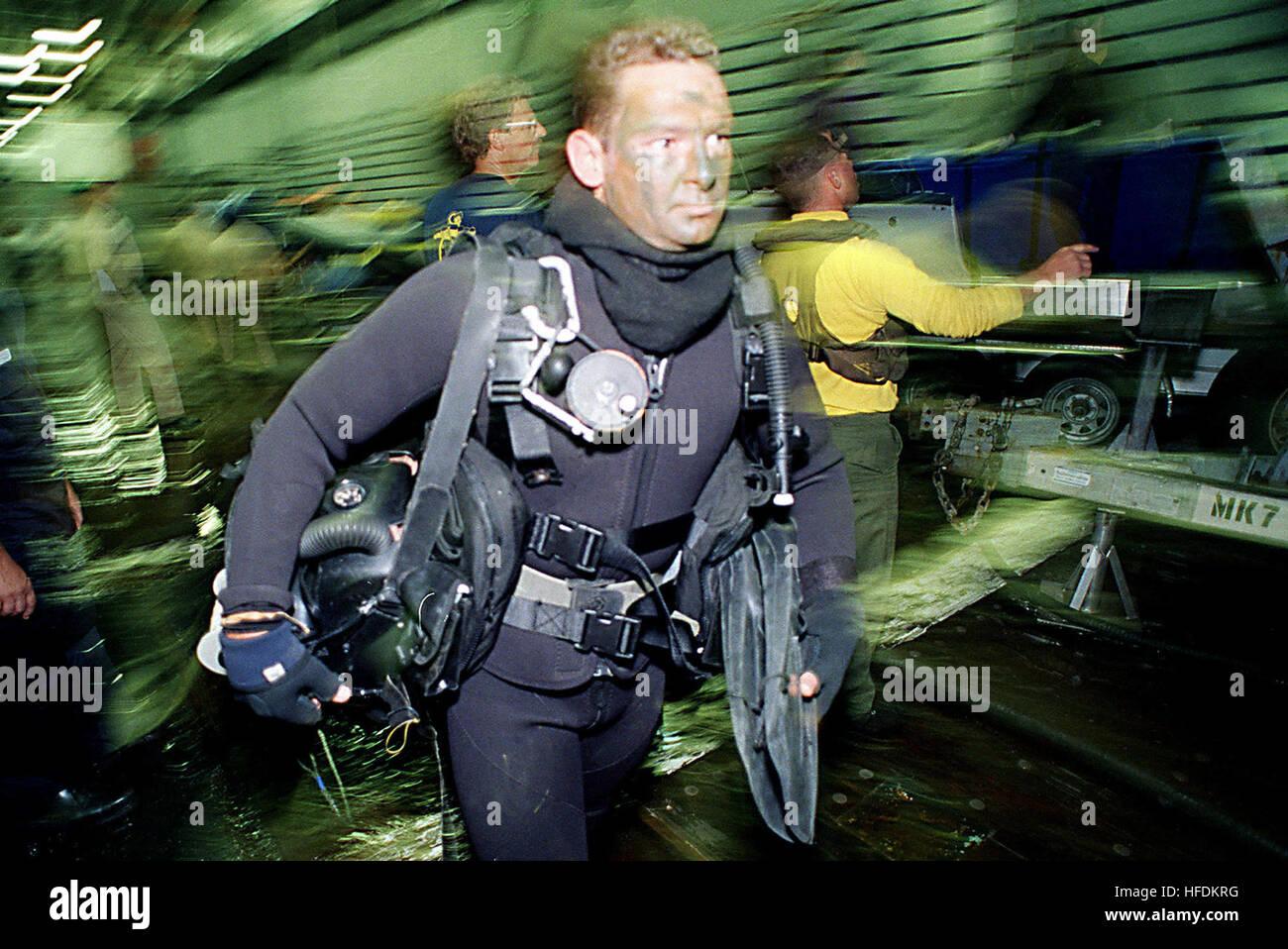 An Australian Clearance Diving Team One diver carries an oxygen closed ...
