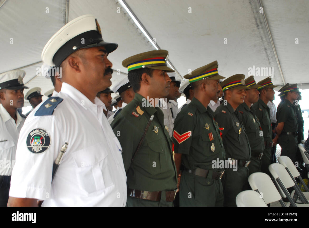 Members of the Mauritian National Coast Guard Police Force stand in ...