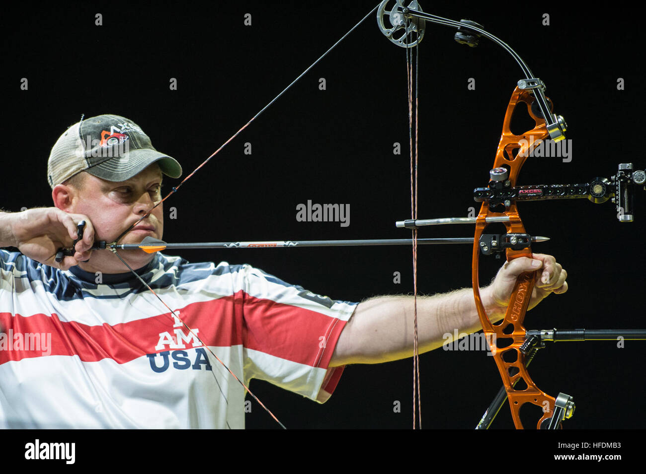 U.S. Marine Corps Maj. Richard Burkett pulls back an arrow during the ...