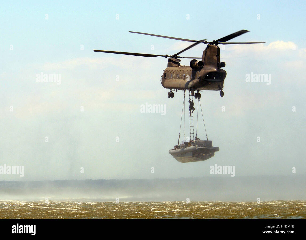 An Army CH-47 helicopter from the 159th Aviation Regiment lifts a Naval ...
