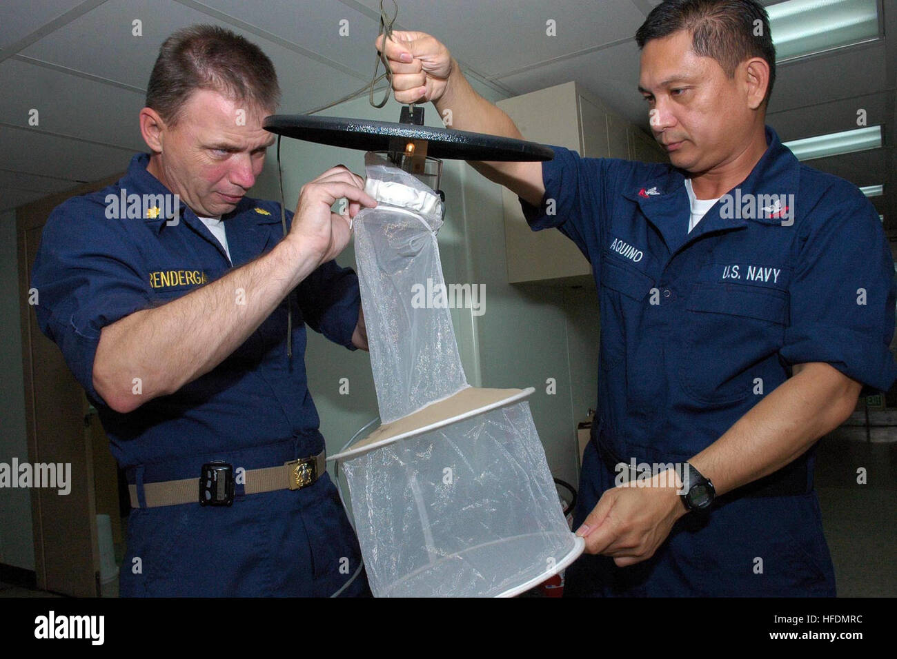 Lt. Cmdr. Brian Prendergast, left, an entomologist from Buffalo, N.Y ...