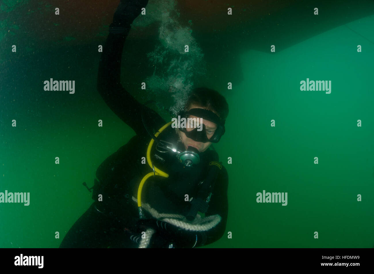 A Navy Diver assigned to Commander Task Group 56.1 conducts an Anti ...