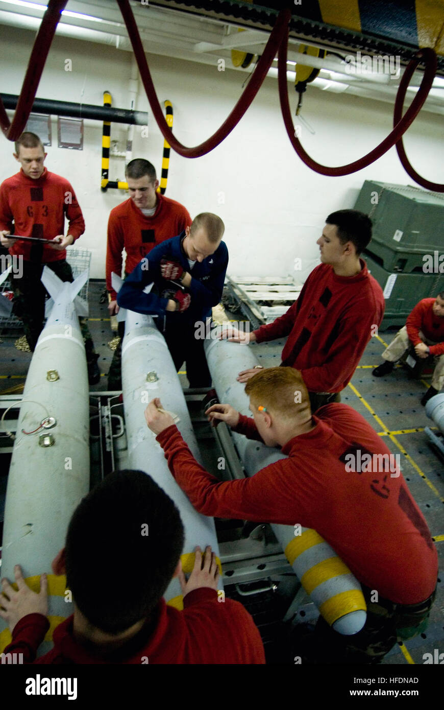 Aviation ordnancemen attach BSU-33 bomb fins to BLU-111 general purpose ...