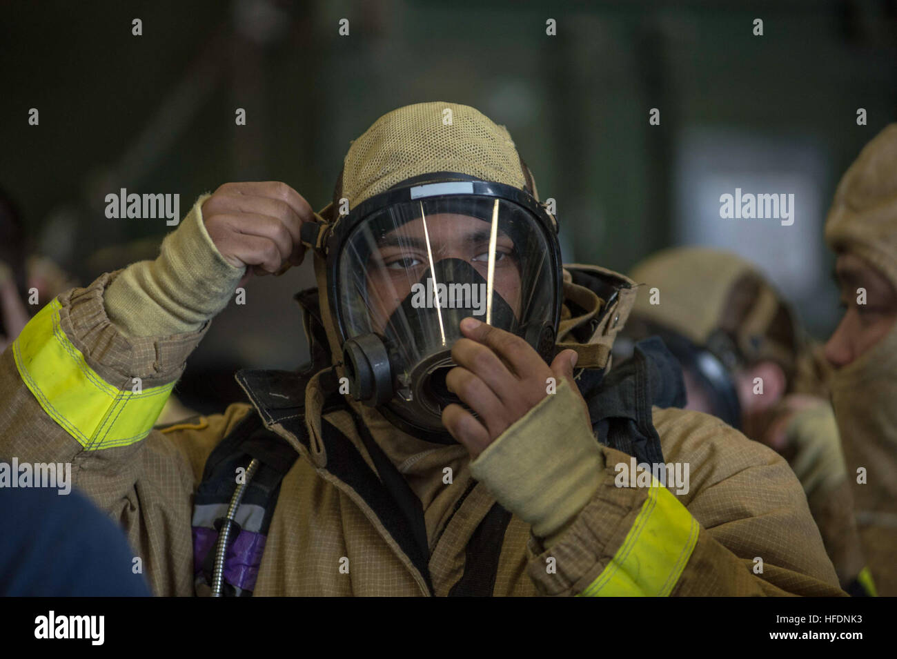 GULF OF ADEN (March 8, 2014) A Sailor dons a self-contained breathing ...