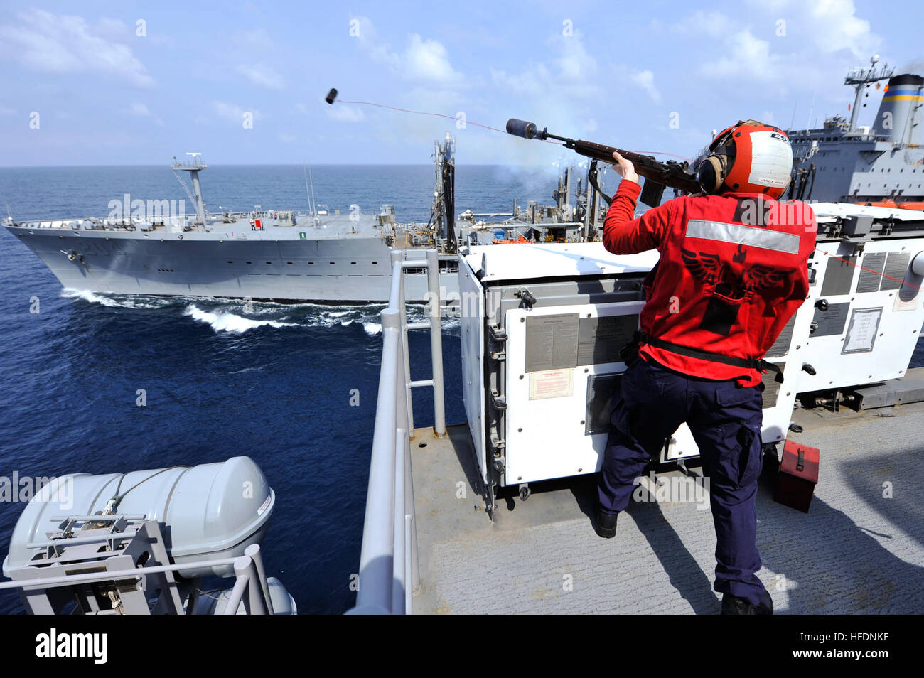 GULF OF THAILAND (Feb. 18, 2013) Aviation Ordnanceman Airman Eric Gajewski fires a shot line ...