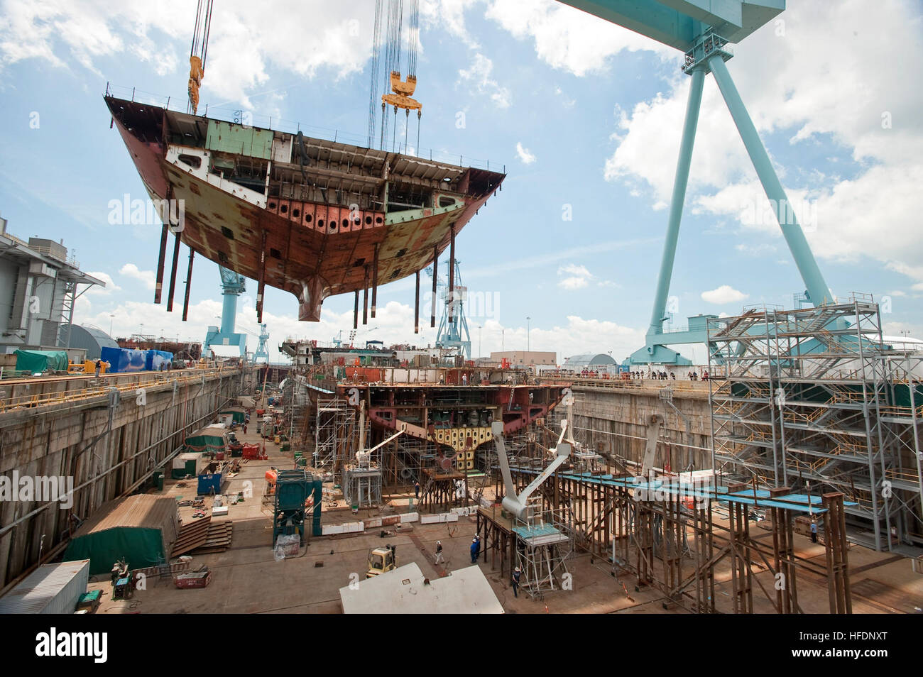 Sections of the aircraft carrier Gerald R. Ford (CVN 78) are moved into ...