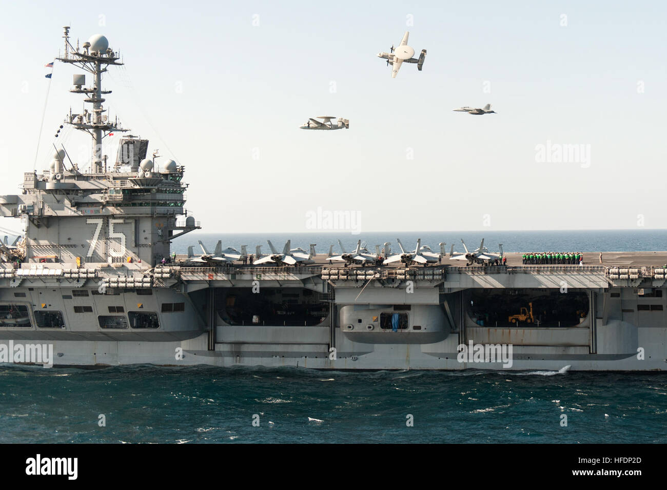 A U.S. Navy E-2C Hawkeye aircraft flown by Cmdr. John Hewitt, top, the ...