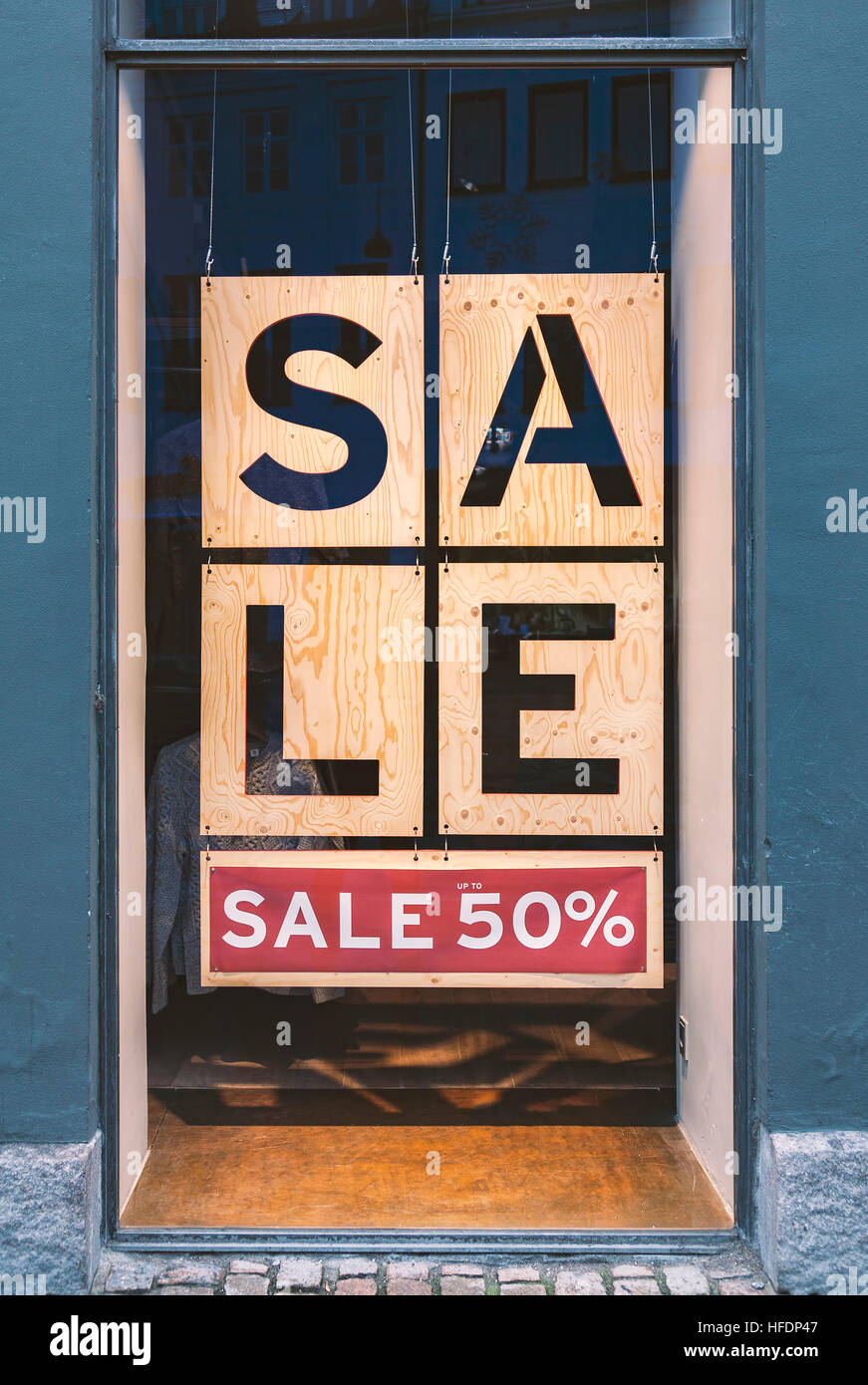 Image of department store window with for sale sign Stock Photo - Alamy