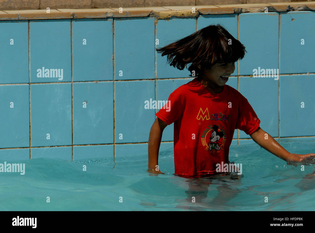 A young Iraqi girl enjoys the new swimming pool that opened in Risalah ...