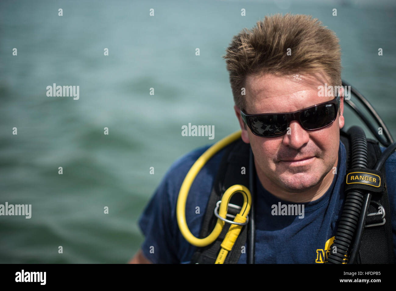 A Navy diver from Mobile Diving and Salvage Unit 2 prepares for an ...