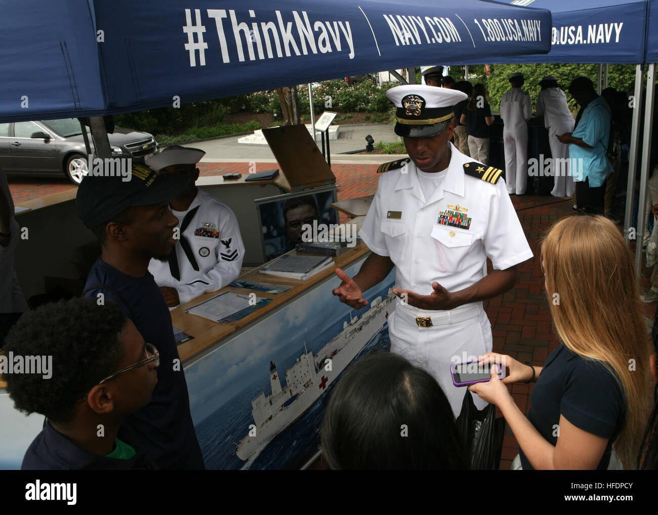 Lt. Cmdr. Michael Fourte speaks with local school children at a ...