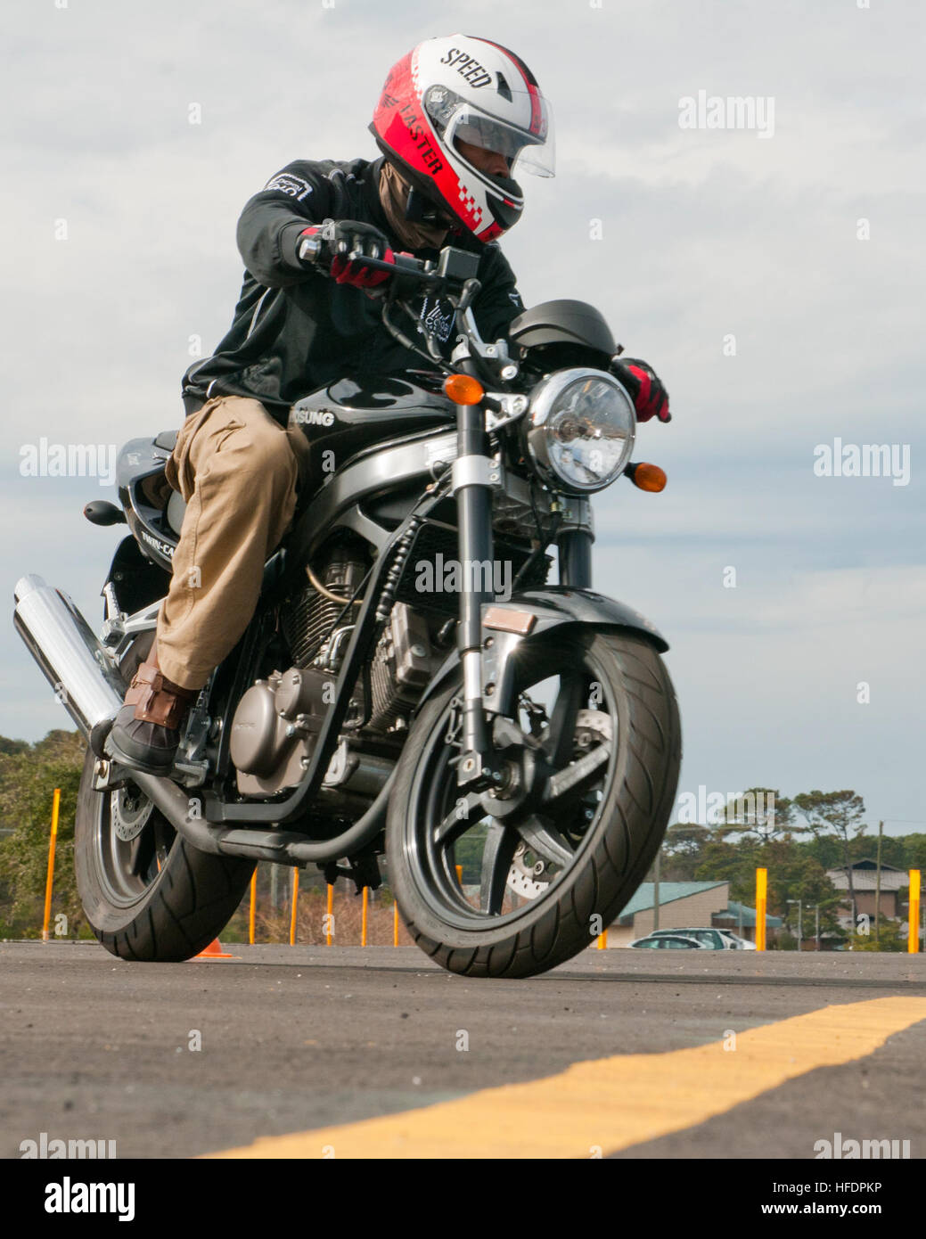 Army Spc. Andrew Harrell navigates a safety course during motorcycle ...