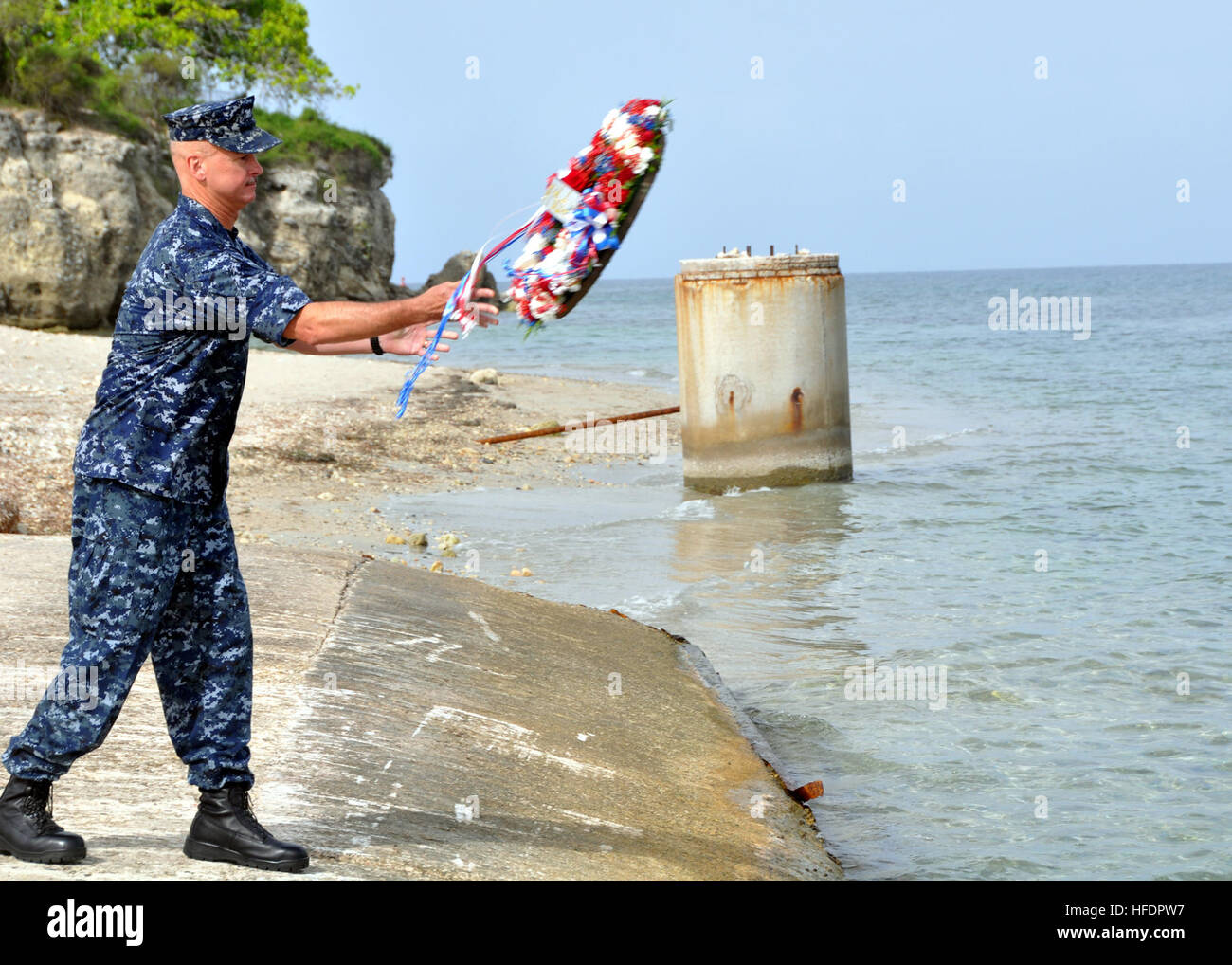A wreath is tossed into the waters at Naval Station Guantanamo Bay ...