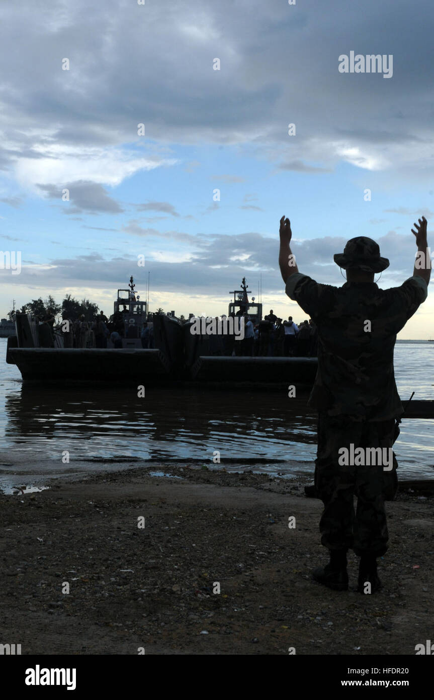 Petty Officer 2nd Class Dustin Miller, assigned to Beach Master Unit 2 ...