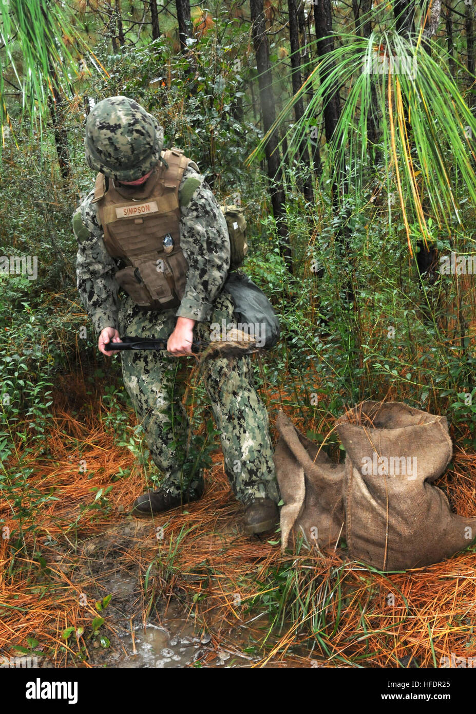 U.S. Navy Builder Constructionman Casey Simpson, with Naval Mobile ...