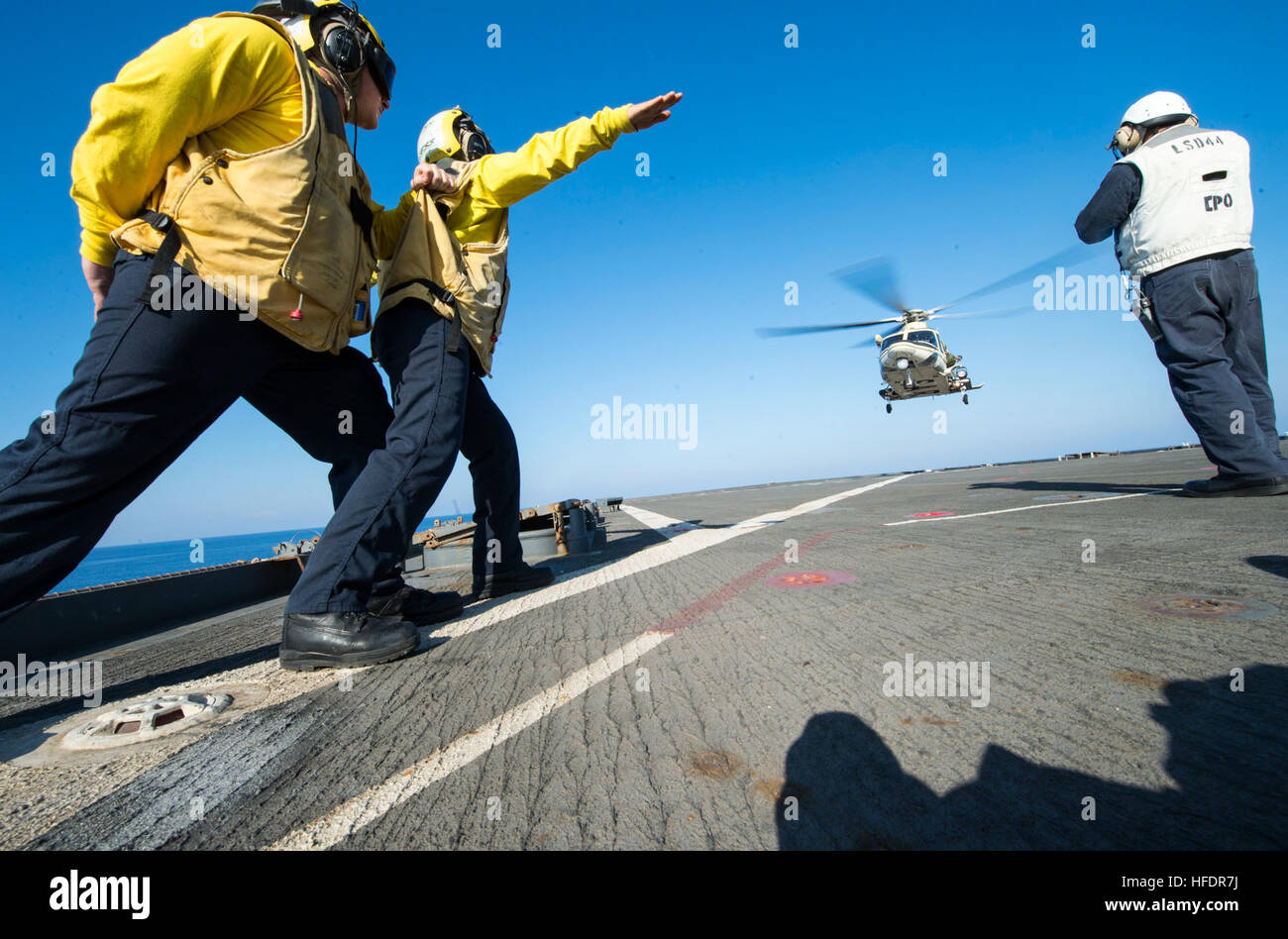 Sailors direct an AW-139 rescue helicopter from the Republic of Cyprus ...
