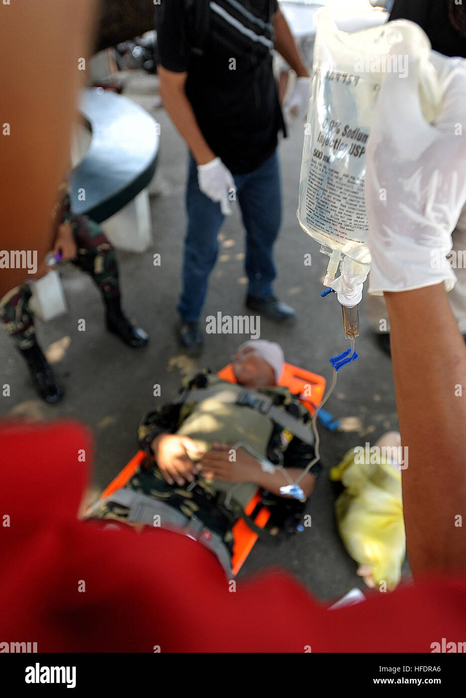 Philippine provincial health workers simulate placing an IV in a head ...