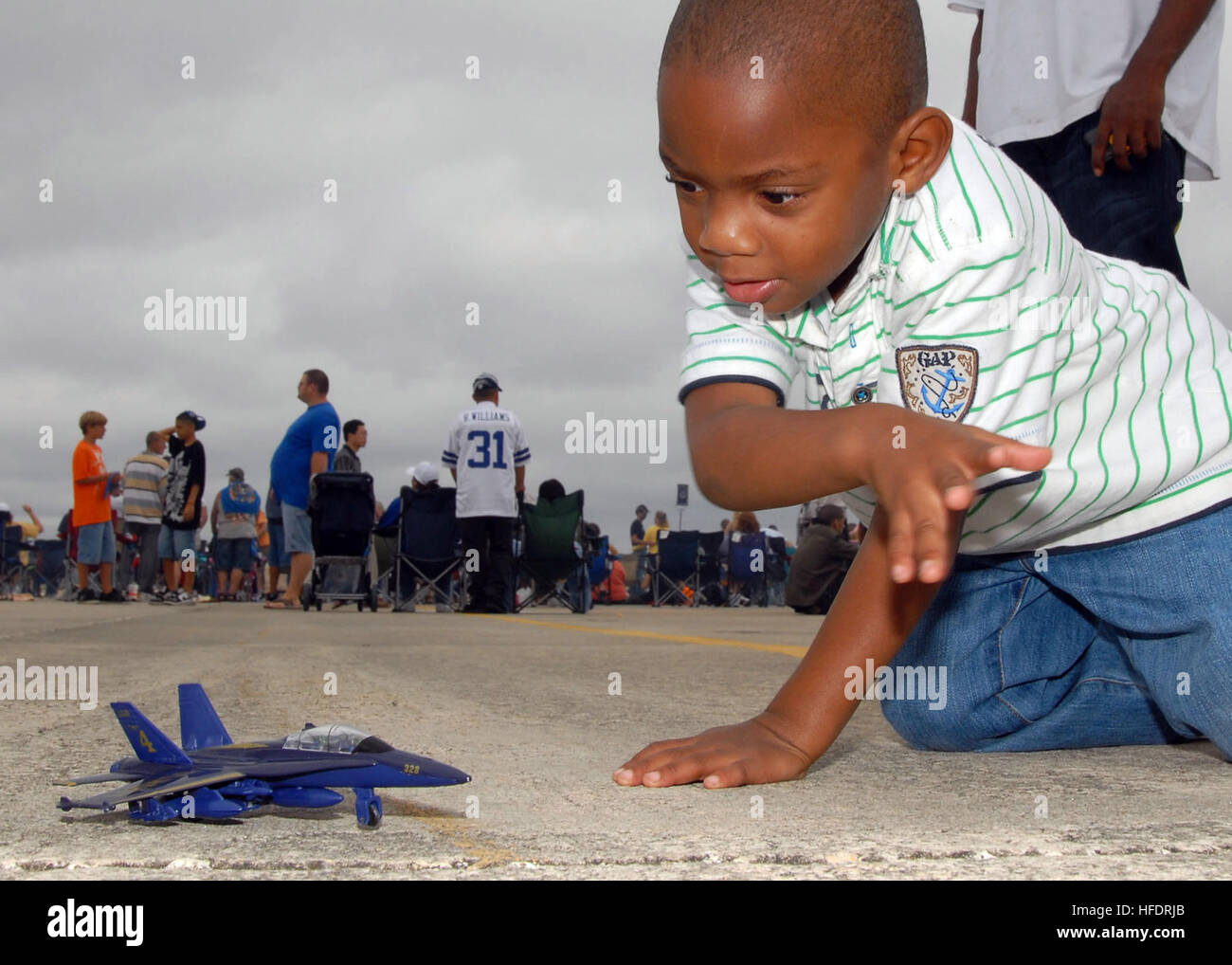 A young boy plays with his Blue Angel model plane at the 2008 Wings of ...