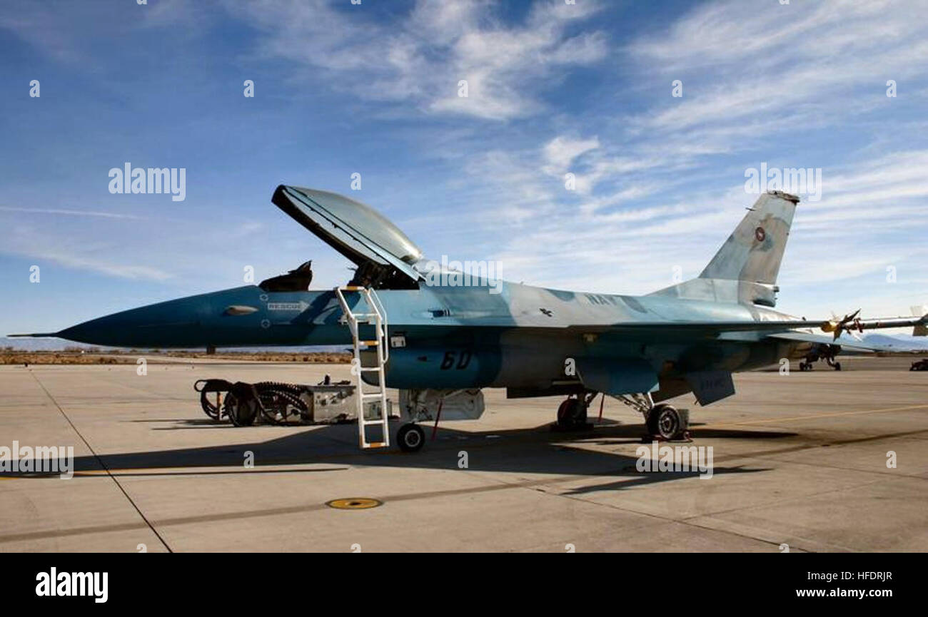 A blue F-16A fighter aircraft of the Naval Strike and Air Warfare ...