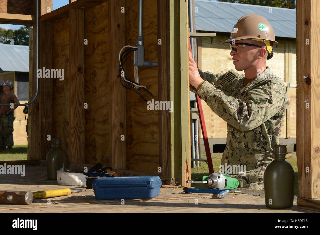 Construction Electrician Constructionman Tim Seyler, assigned to Naval ...