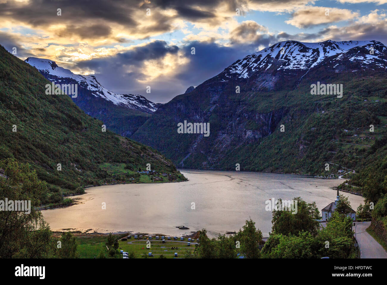 Late in the day light reflecting from the waters of the fjord at ...