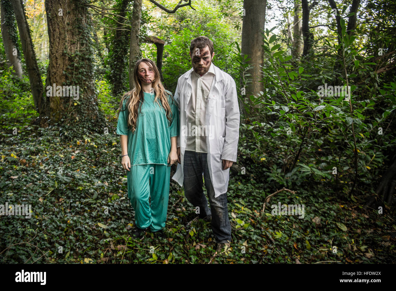 People dressed and made up as zombies in the woods in a 'The Walking ...