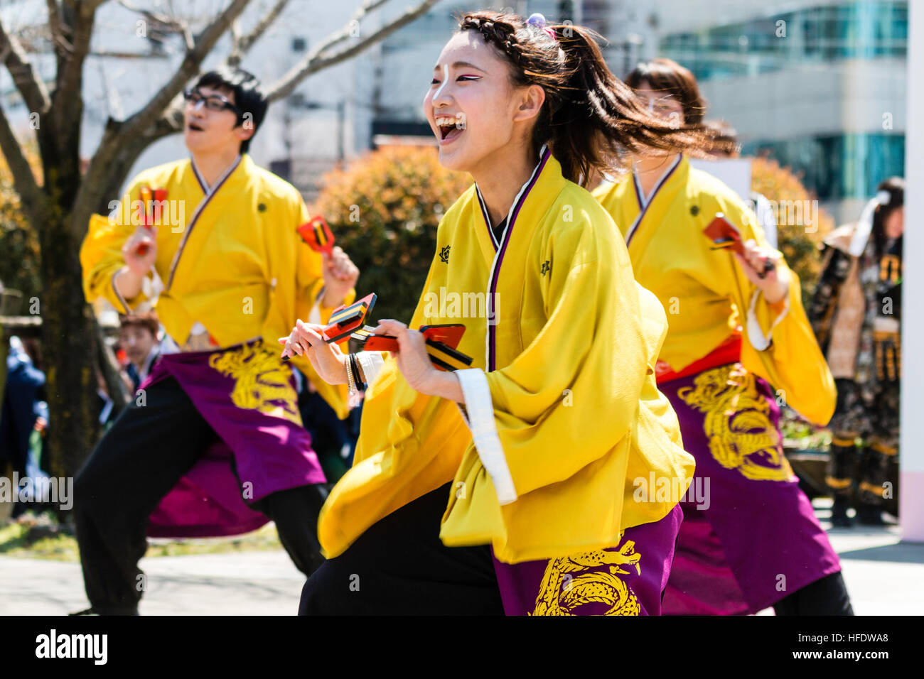 Hinokuni Yosakoi dance Festival. Smiling young woman in yellow yukata ...