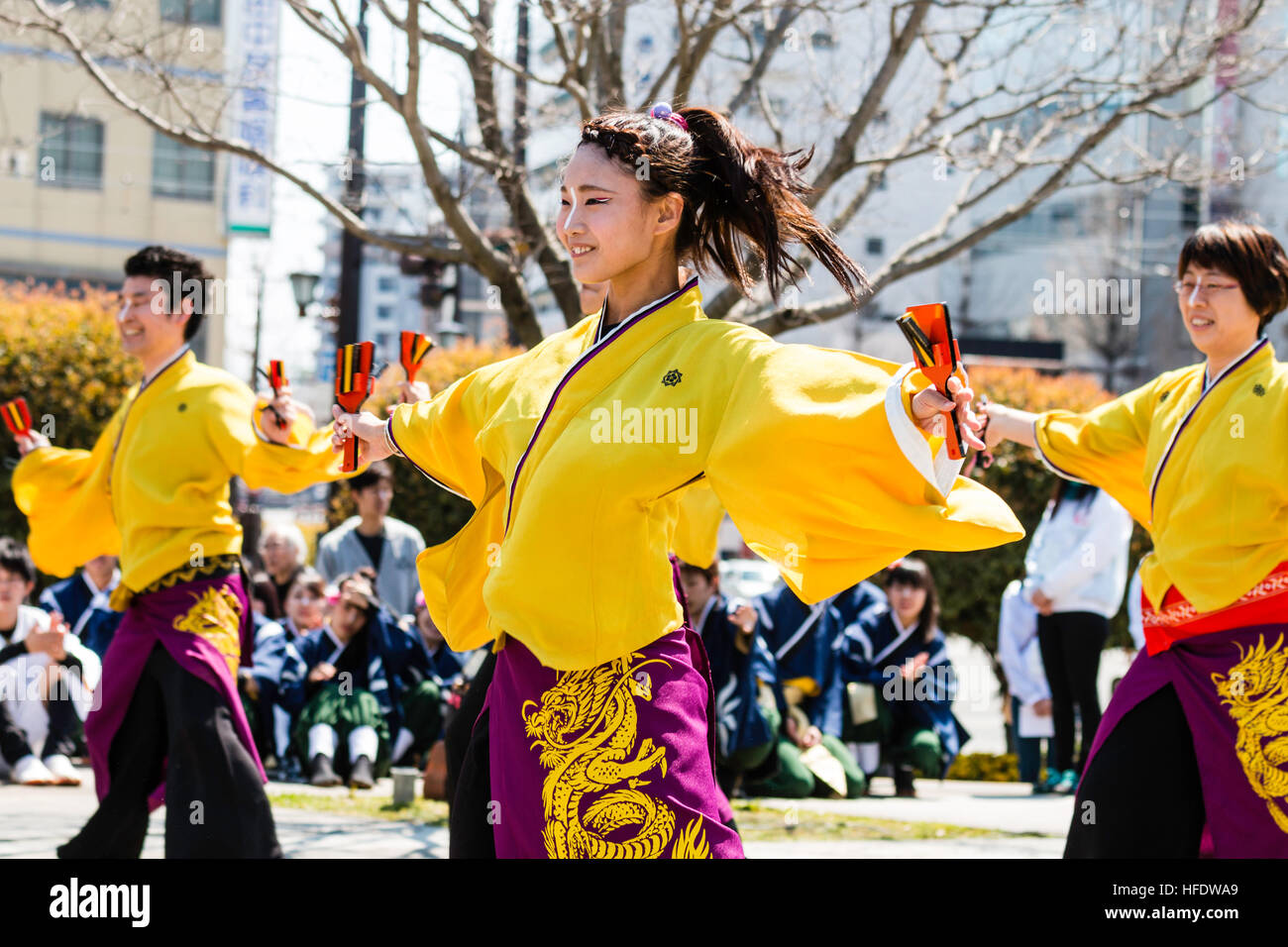 Hinokuni Yosakoi dance Festival. Smiling young woman in yellow yukata ...