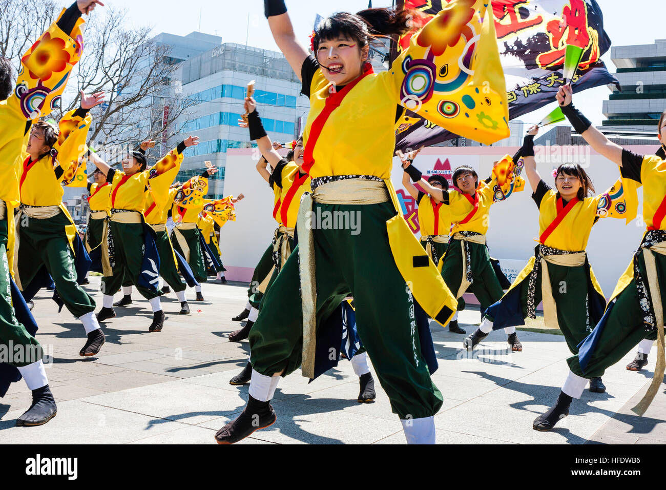 Japanese Yosakoi dance Festival. Young women dancers in yellow yukata ...