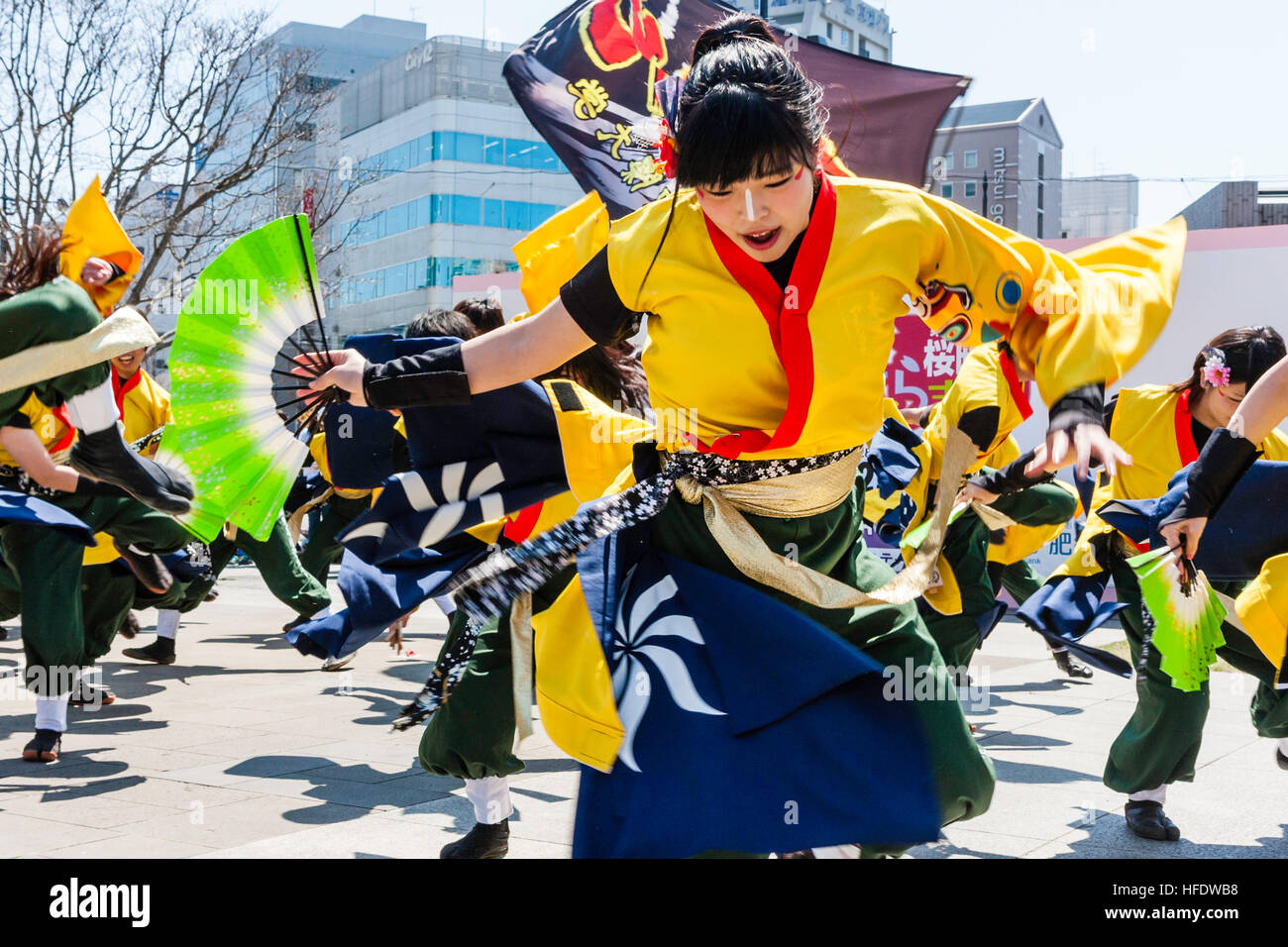 Japanese Yosakoi dance Festival. Young women dancers in yellow yukata ...