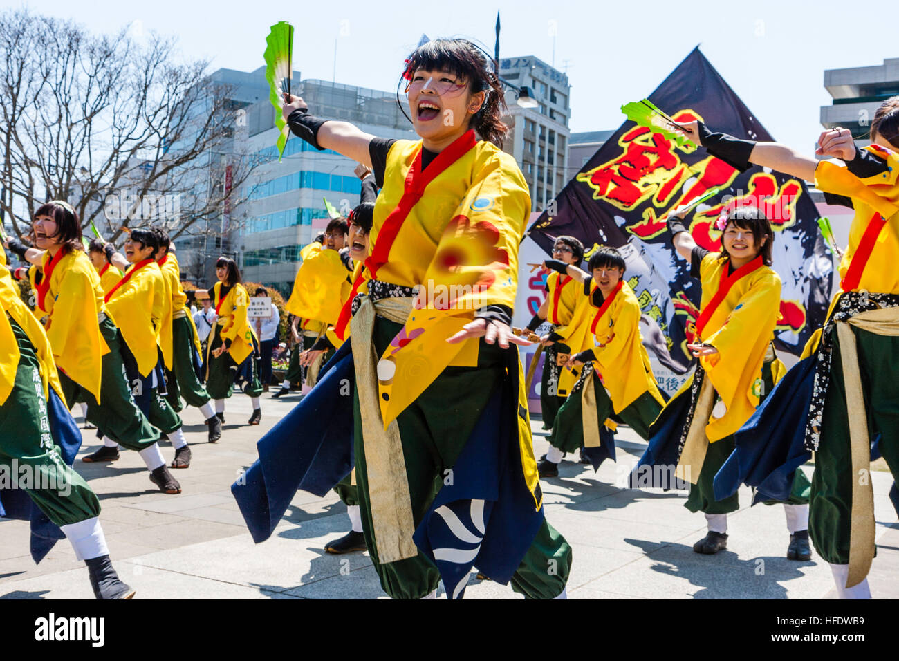 Japanese Yosakoi dance Festival. Young women dancers in yellow yukata ...