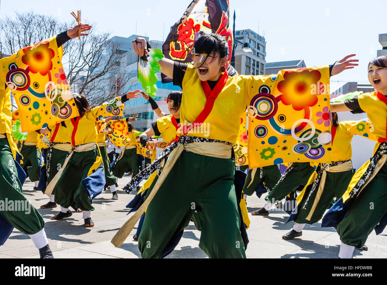 Japanese Yosakoi dance Festival. Young women dancers in yellow yukata ...