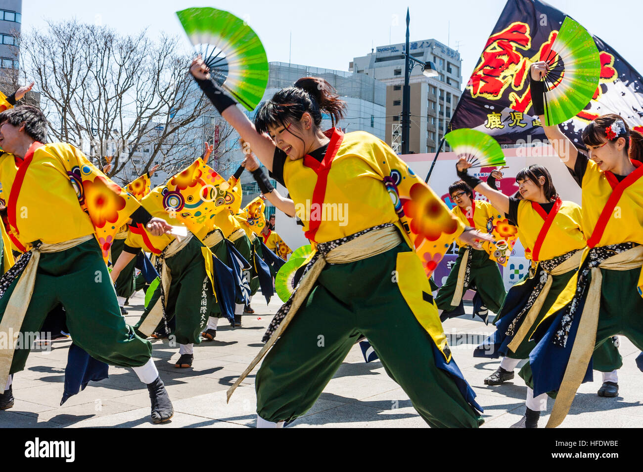 Japanese Yosakoi dance Festival. Young women dancers in yellow yukata ...