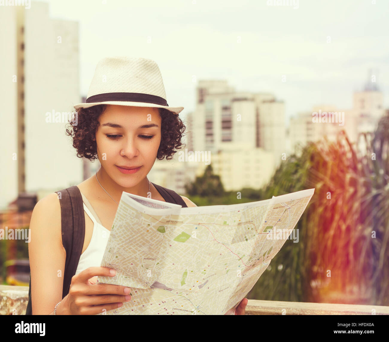 Woman looking for directions in touristic map at urban scenario. Color ...