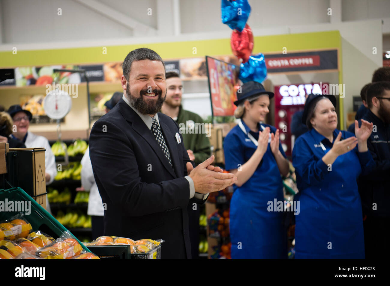 Staff (colleagues) lined up to welcome greet and applaud people ...
