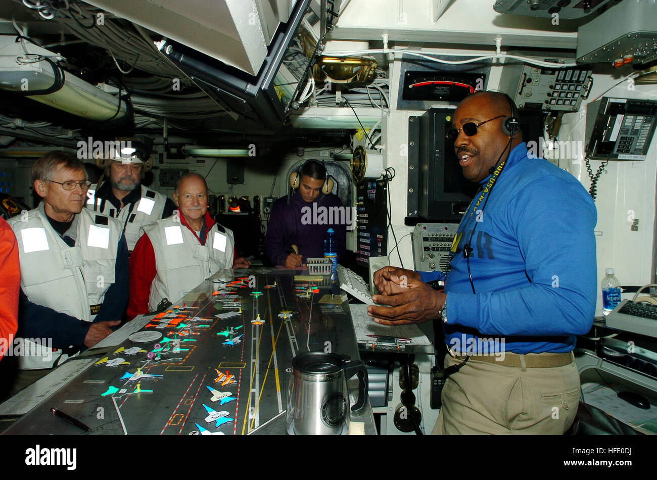 Flight deck handlers aboard USS John C. Stennis (CVN 74) coordinate the ...