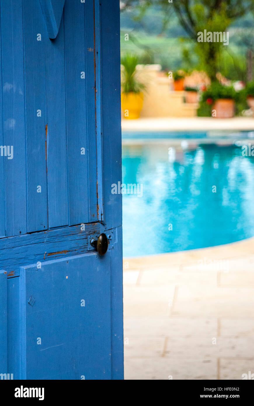 door opening onto swimming pool area Stock Photo - Alamy