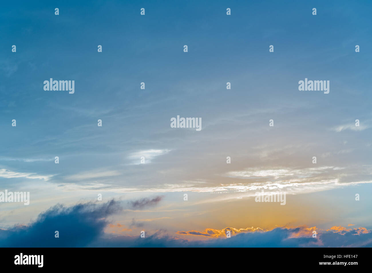 yellow sunset sky with clouds Stock Photo - Alamy