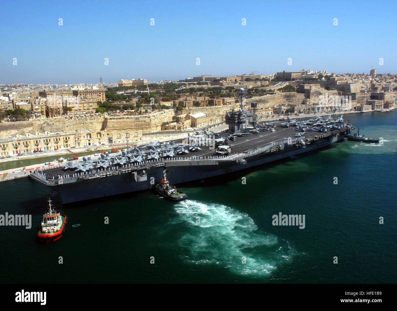 040626-N-8704K-002 Valletta, Malta (June 26,2004) - Tugboats assist the ...