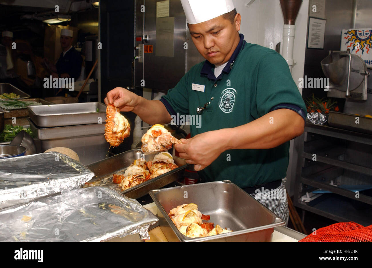 Culinary Specialist 3rd Class prepares lobster tails for over 5,000 ...