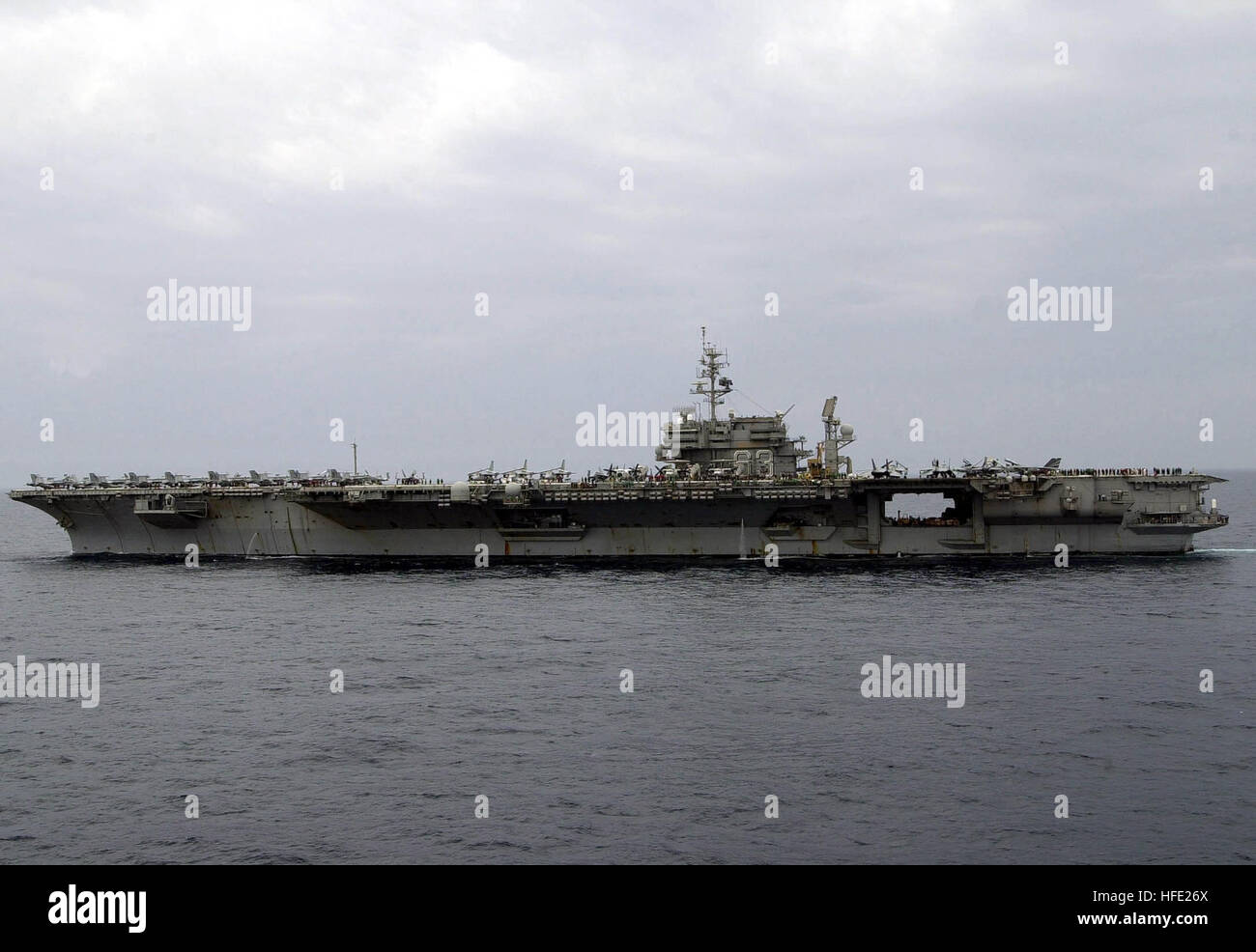 USS Kitty Hawk (CV 63) operates in the Arabian Gulf, heading toward the ...