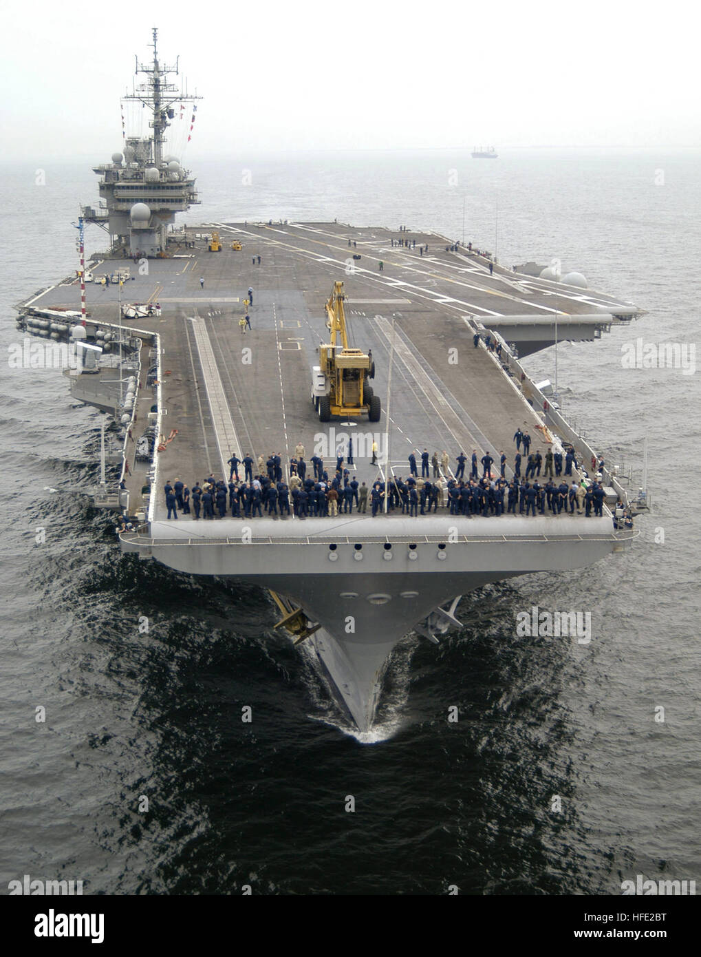 USS Kitty Hawk (CV 63) departs Yokosuka Naval Base to transit Tokyo Bay ...
