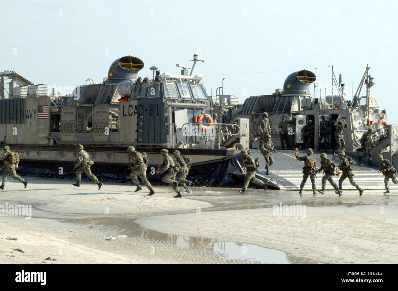 Landing force members of the Royal Malay Regiment disembark from U.S ...