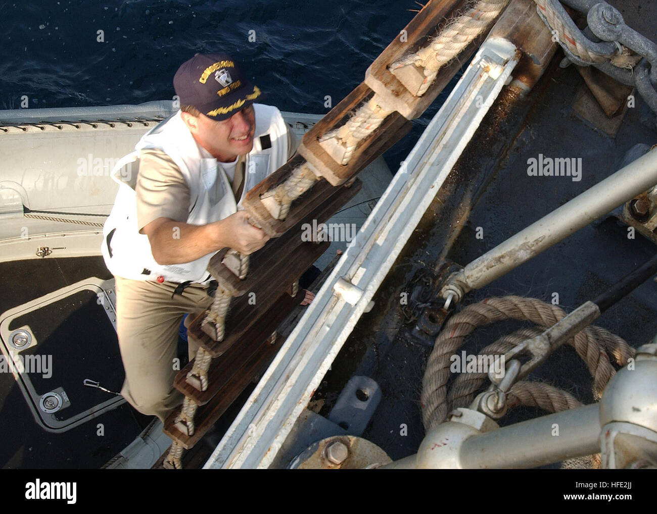 Commander of Destroyer Squadron 24 climbs onto British Duke-class ...
