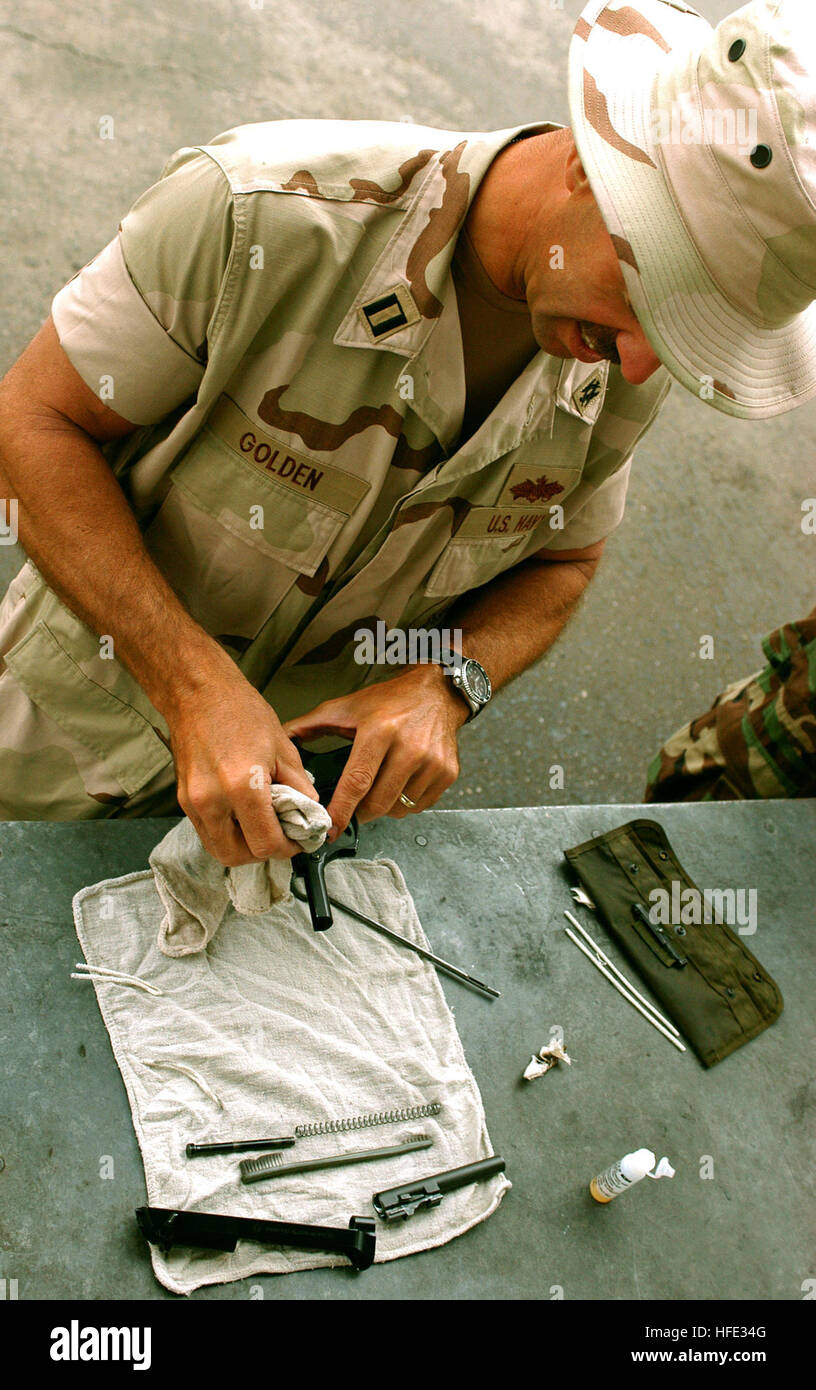 NMCB-23 personnel disassemble, clean, and reassemble 9mm pistols during ...